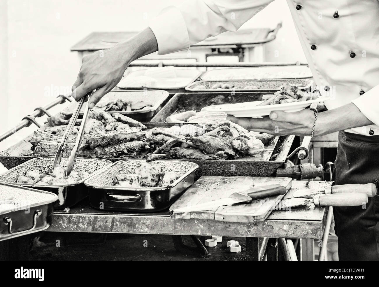 Masterchef serves grilled meat. Detail food and hands scene. Feast ...