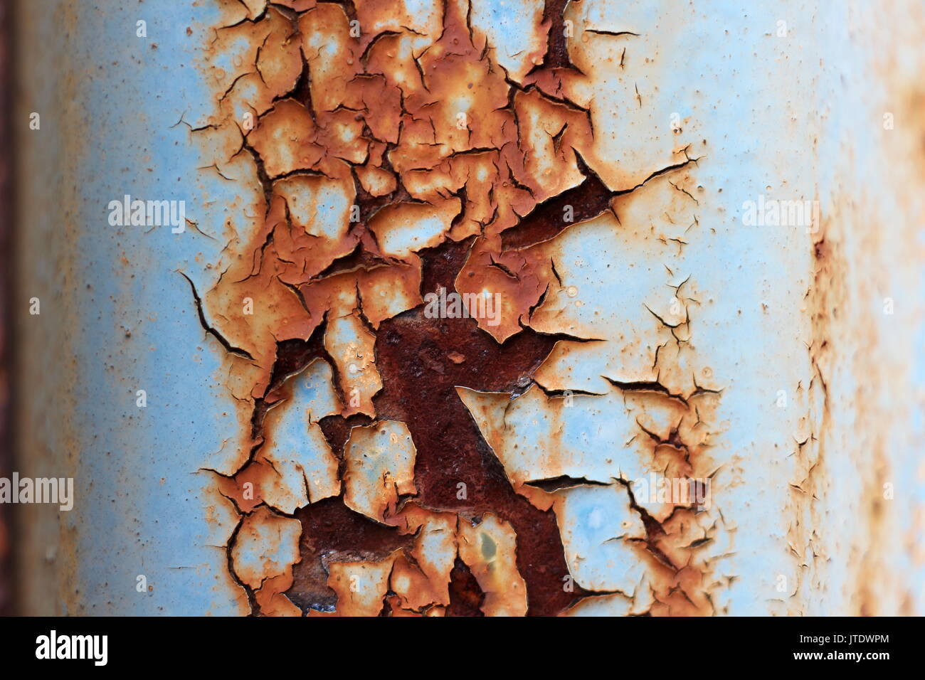 Texture image of cracking blue paint and underlying rust, creating ...
