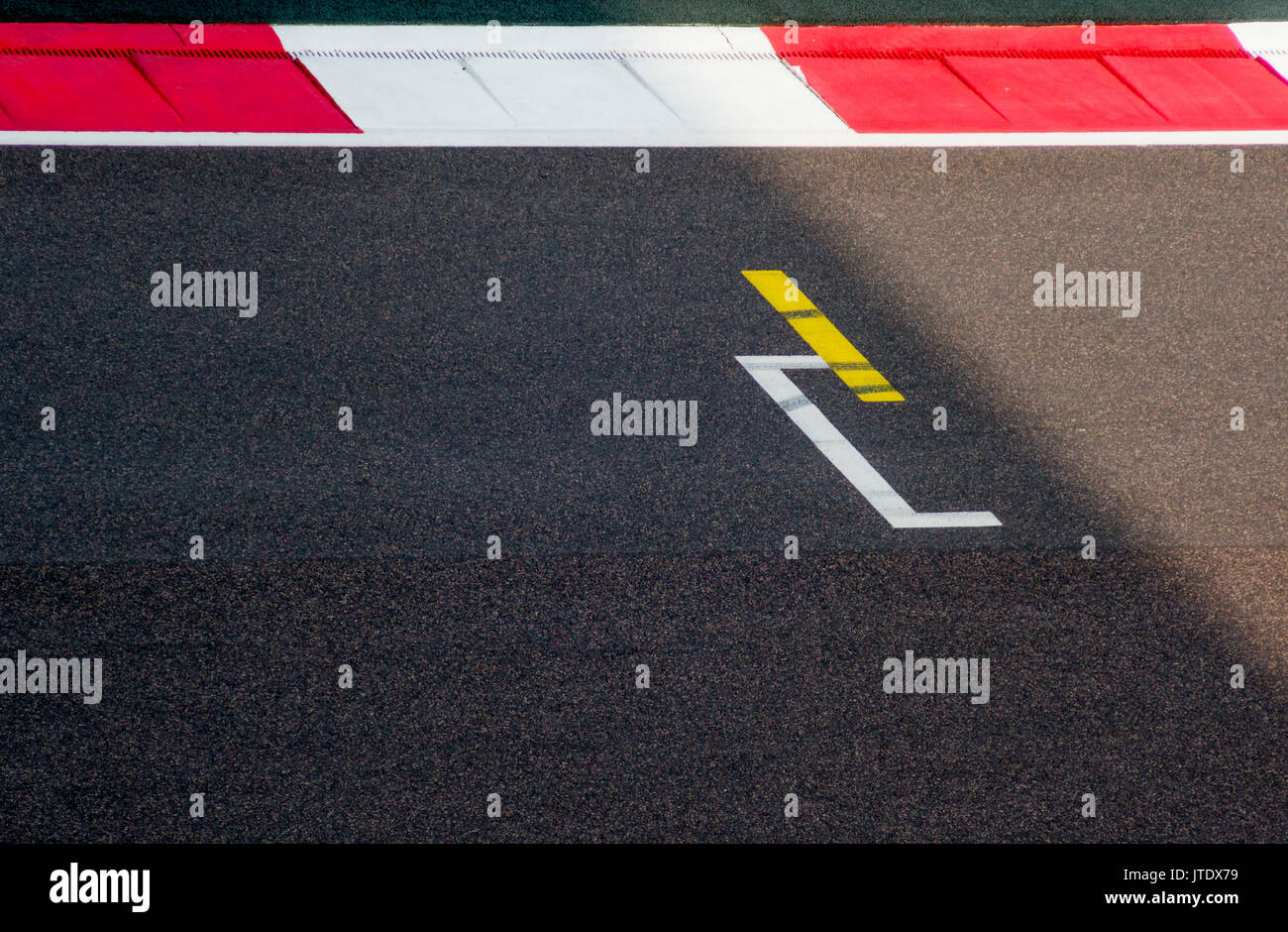 Starting line and red white boundry of a racing track. Starting point ...