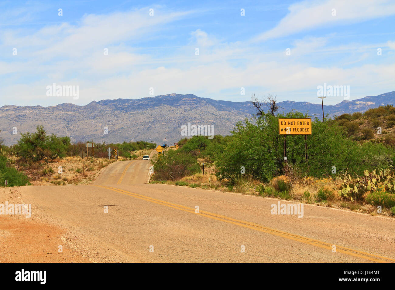 Do not enter when flooded flash flood area warning sign on a roadside ...