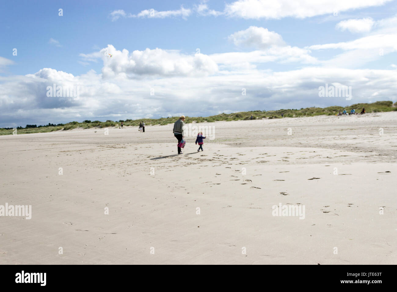 Scotland, Highlands, Nairn, People Walking on the Beach, Imprints in ...