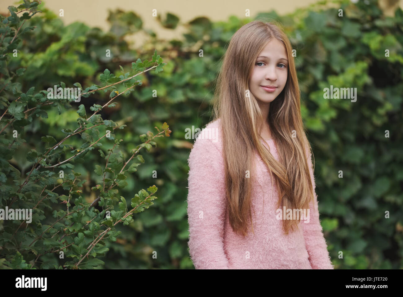 photo of beautiful young girl posing on the street Stock Photo - Alamy