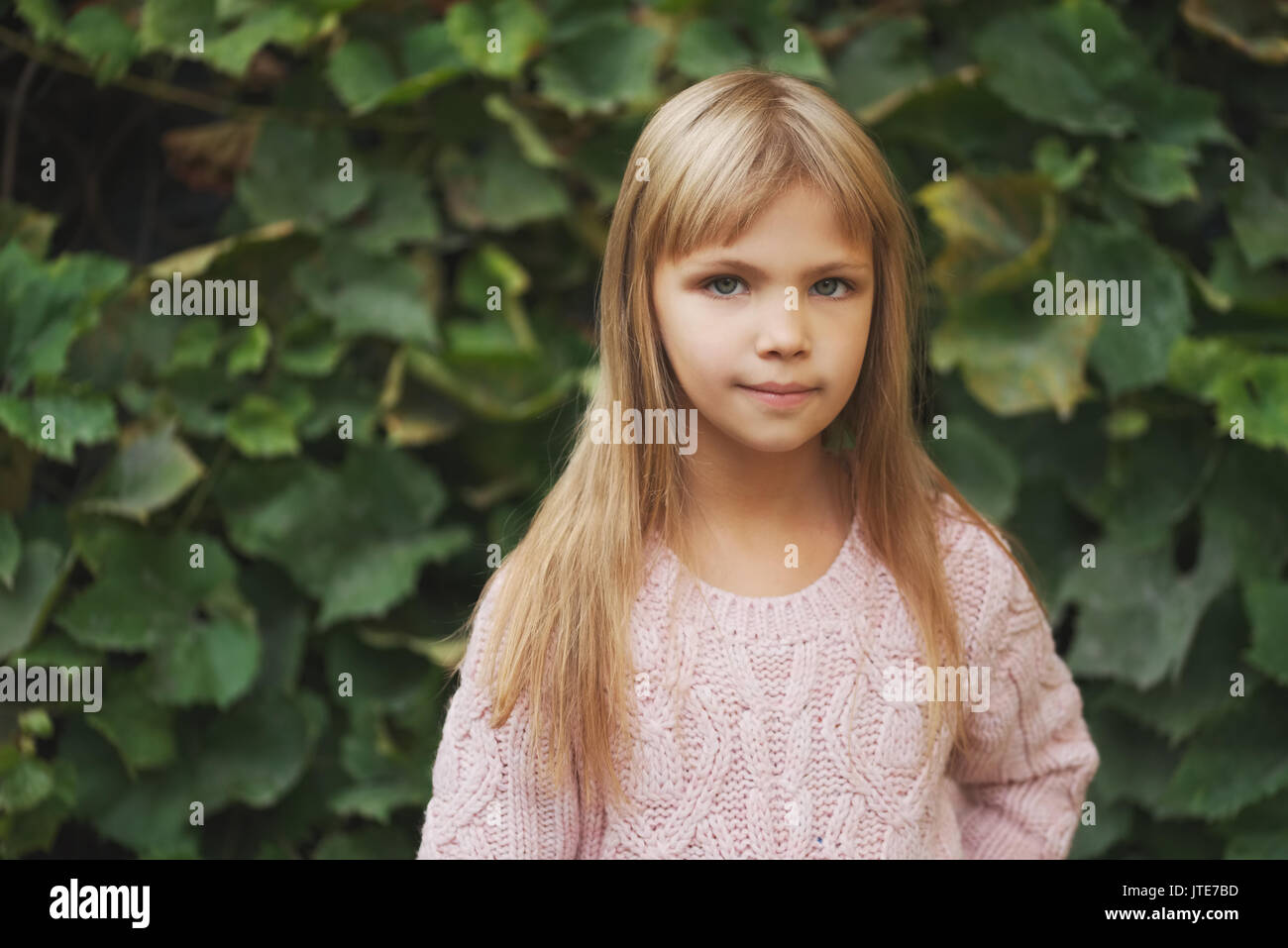 photo of beautiful young girl posing on the street Stock Photo - Alamy