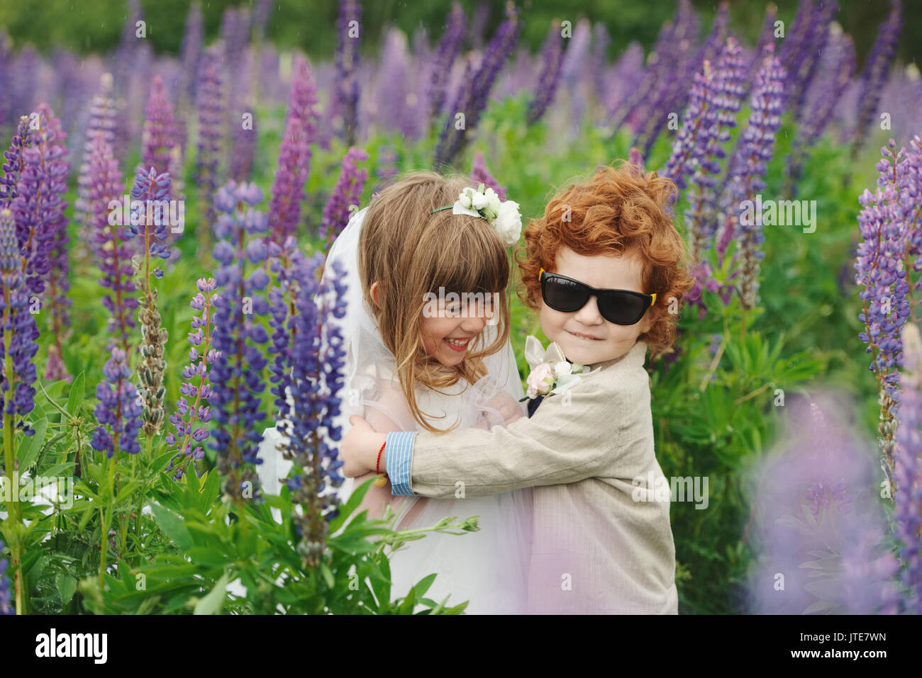 photo of two funny little bride and groom Stock Photo - Alamy