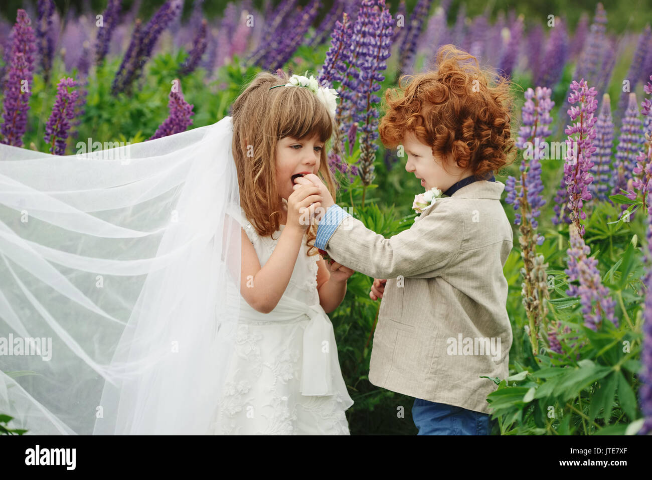 photo of two funny little bride and groom Stock Photo - Alamy