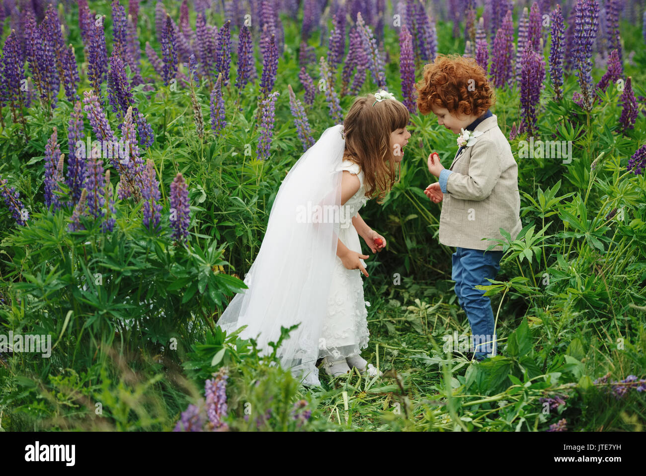 photo of two funny little bride and groom Stock Photo - Alamy