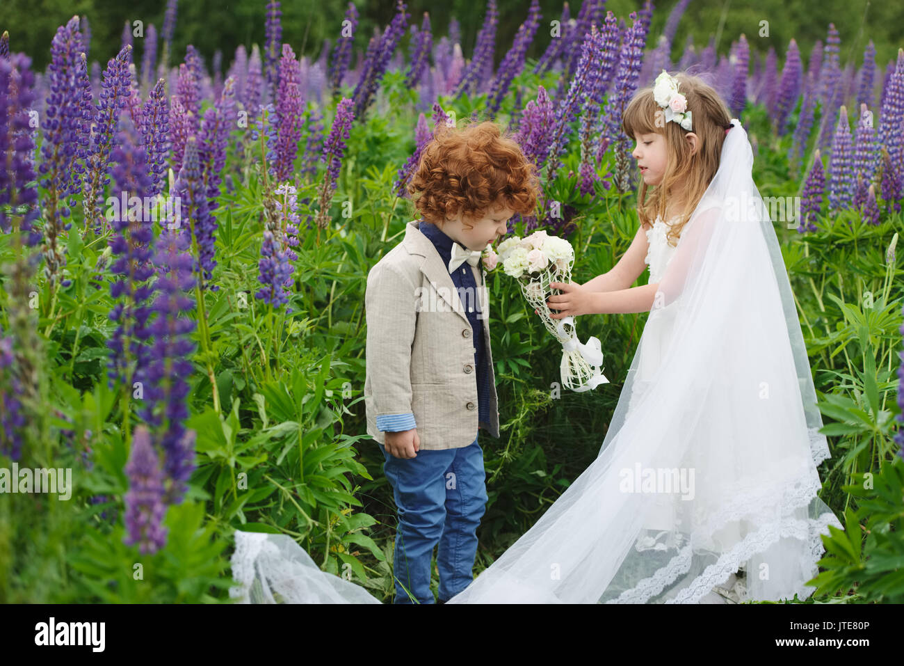 photo of two funny little bride and groom Stock Photo - Alamy