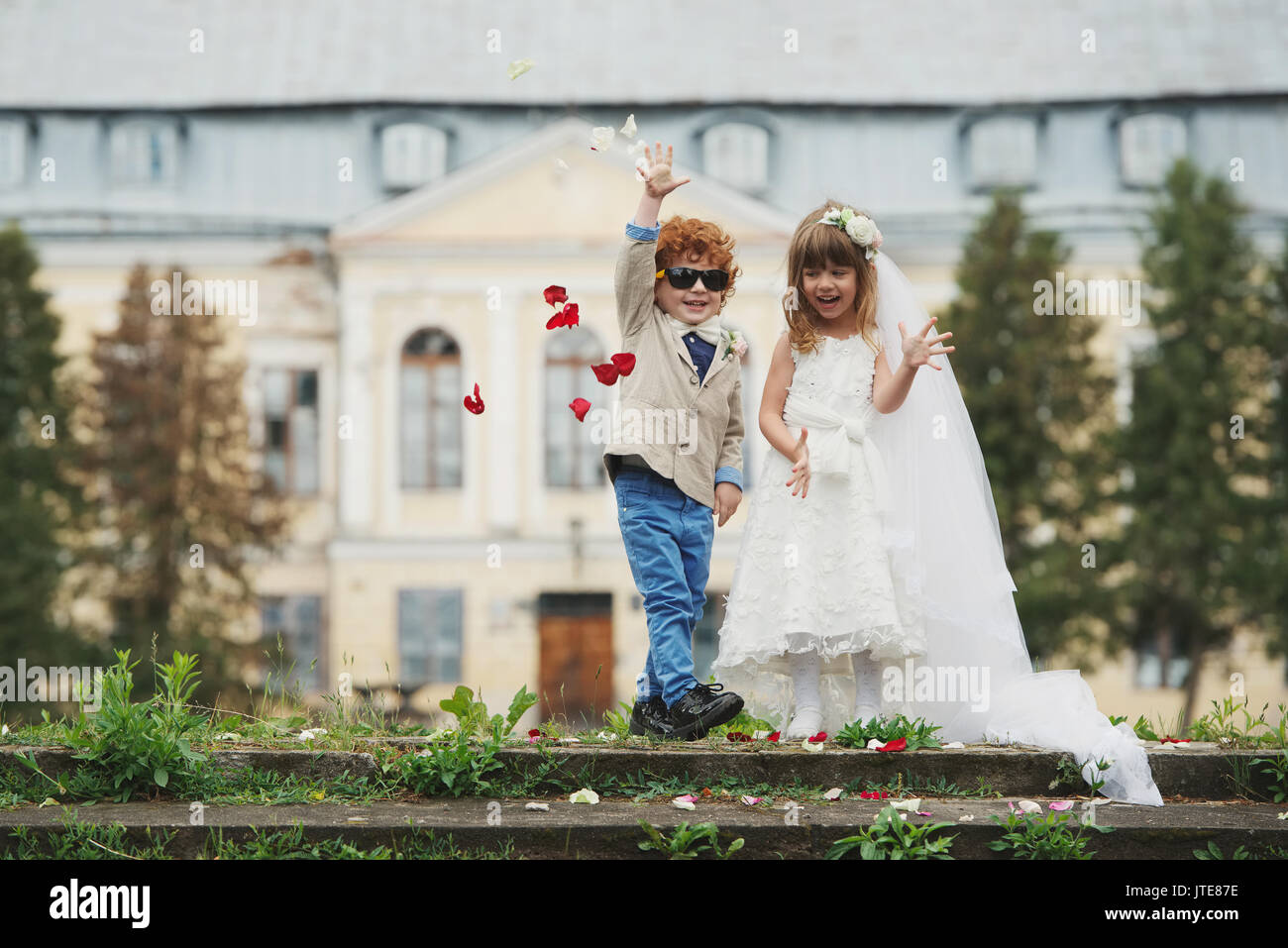 photo of two funny little bride and groom Stock Photo - Alamy