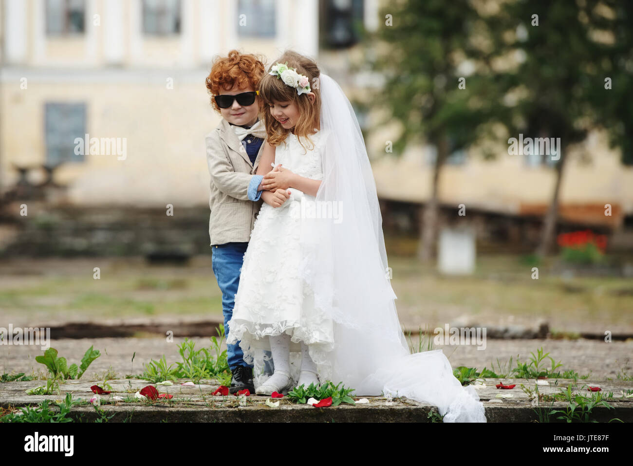 photo of two funny little bride and groom Stock Photo - Alamy