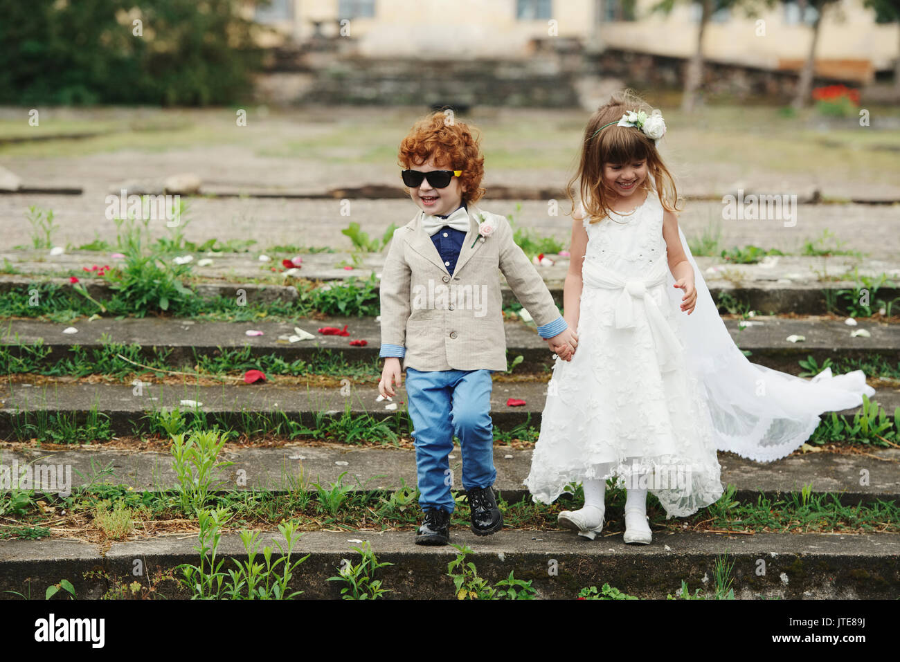photo of two funny little bride and groom Stock Photo - Alamy