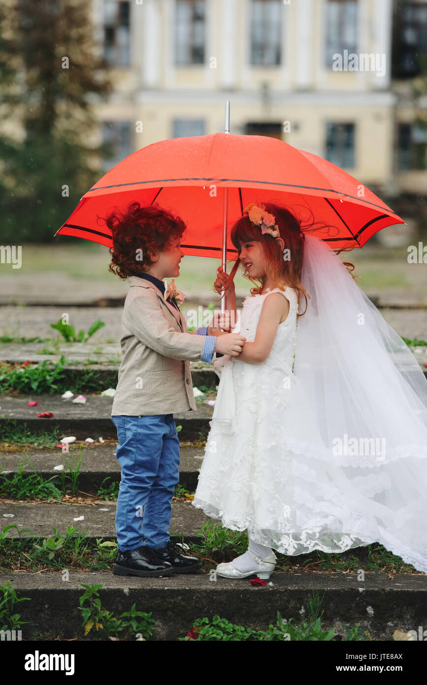 photo of two funny little bride and groom Stock Photo - Alamy