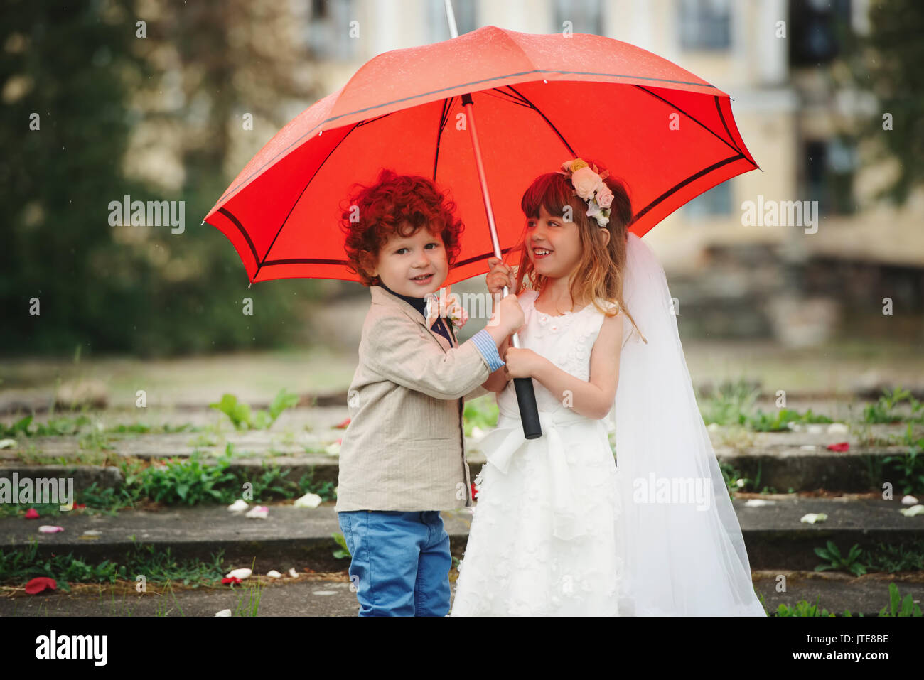 photo of two funny little bride and groom Stock Photo - Alamy