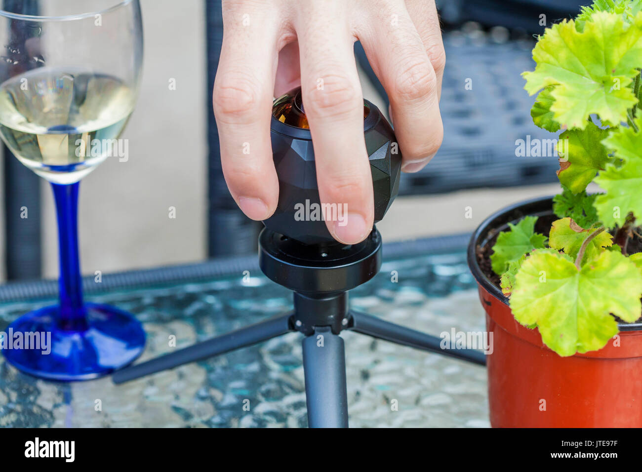 Hand taking three sixty degree camera Stock Photo - Alamy