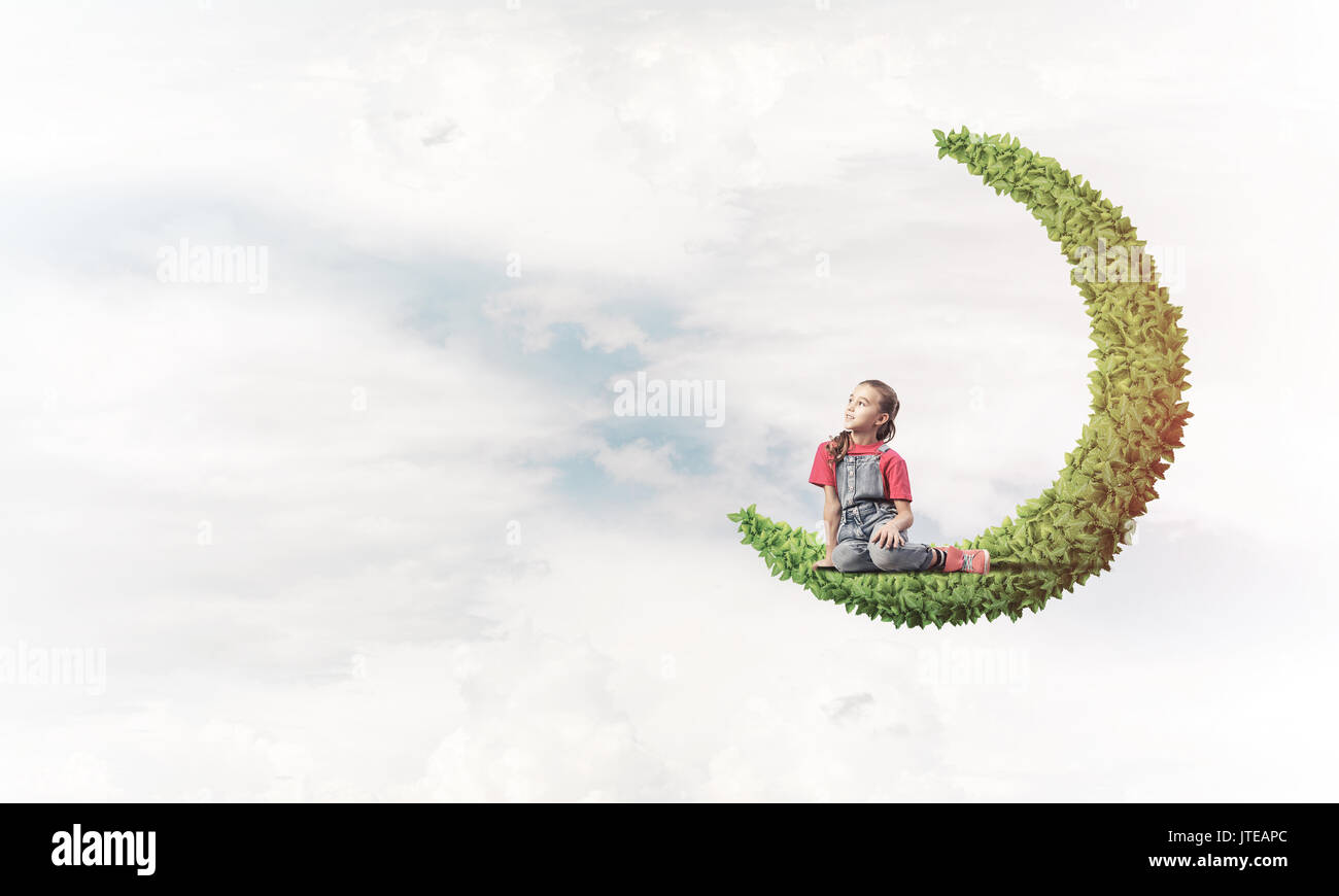 Concept of careless happy childhood with girl dreaming about som Stock ...