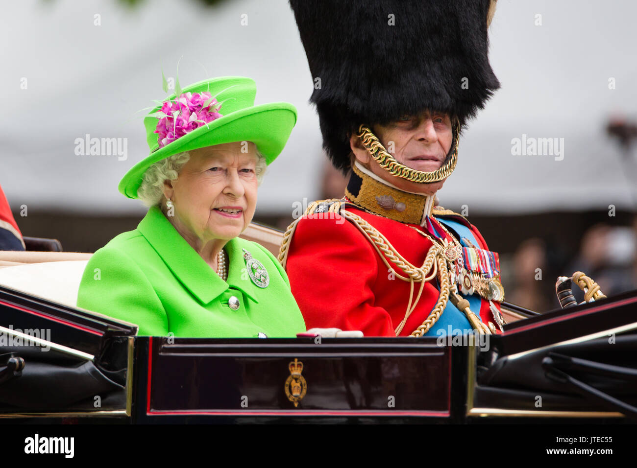 Her Majesty, Queen Elizabeth II, wears a neon green Stewart Parvin coat ...
