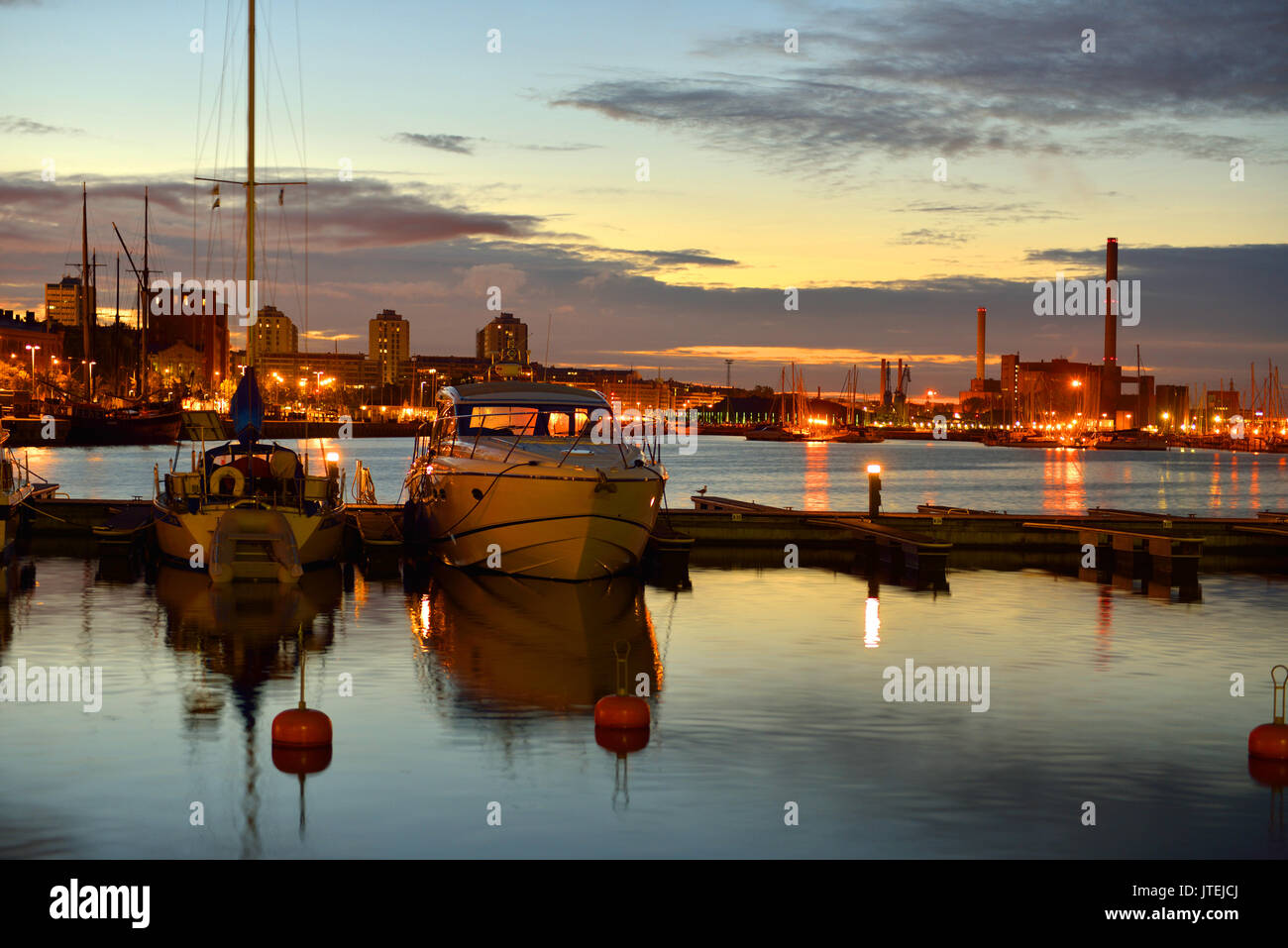 Sunset in Helsinki. Ships and yachts sleep in harbor Stock Photo - Alamy