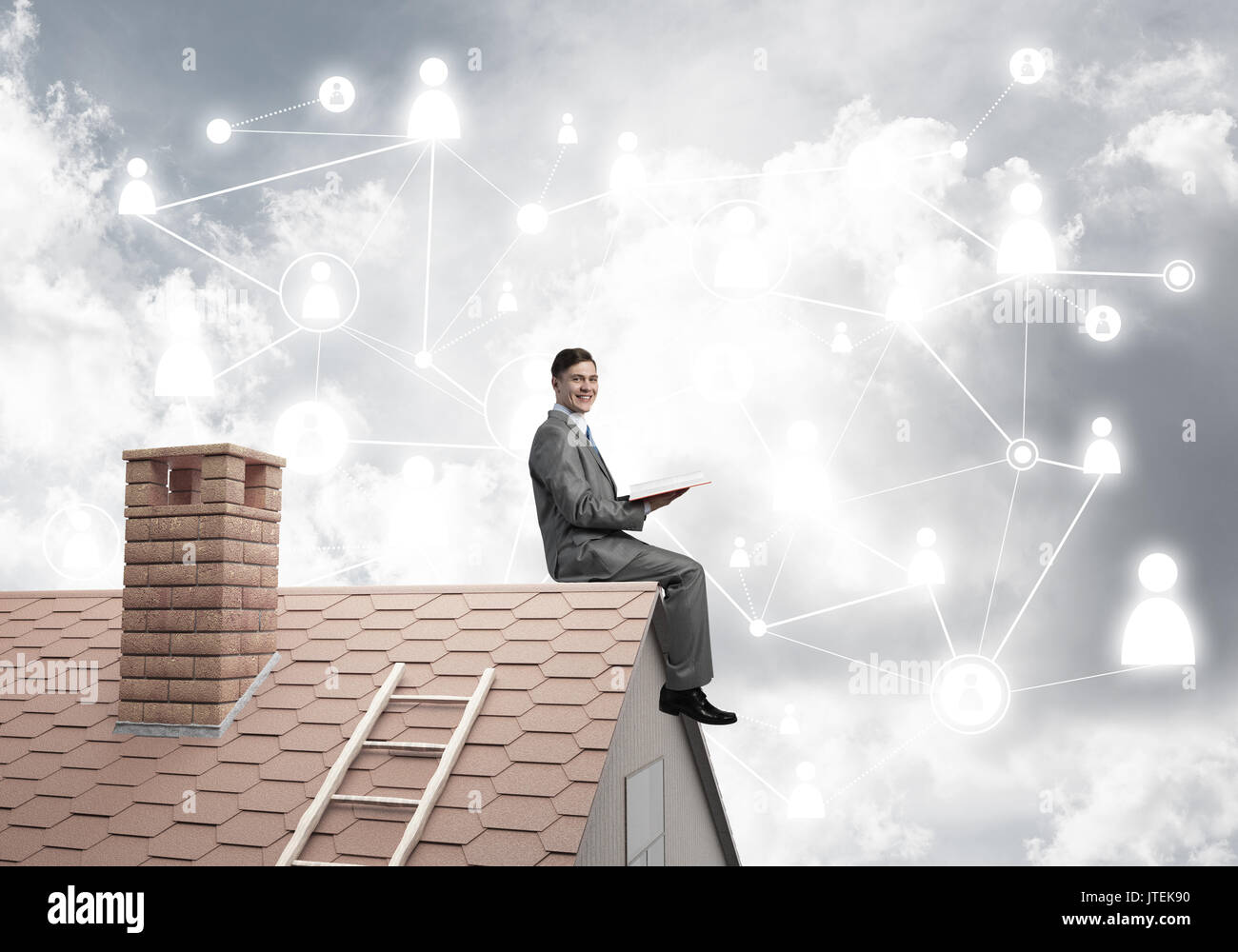 Man on roof reading book and concept of social connection Stock Photo ...