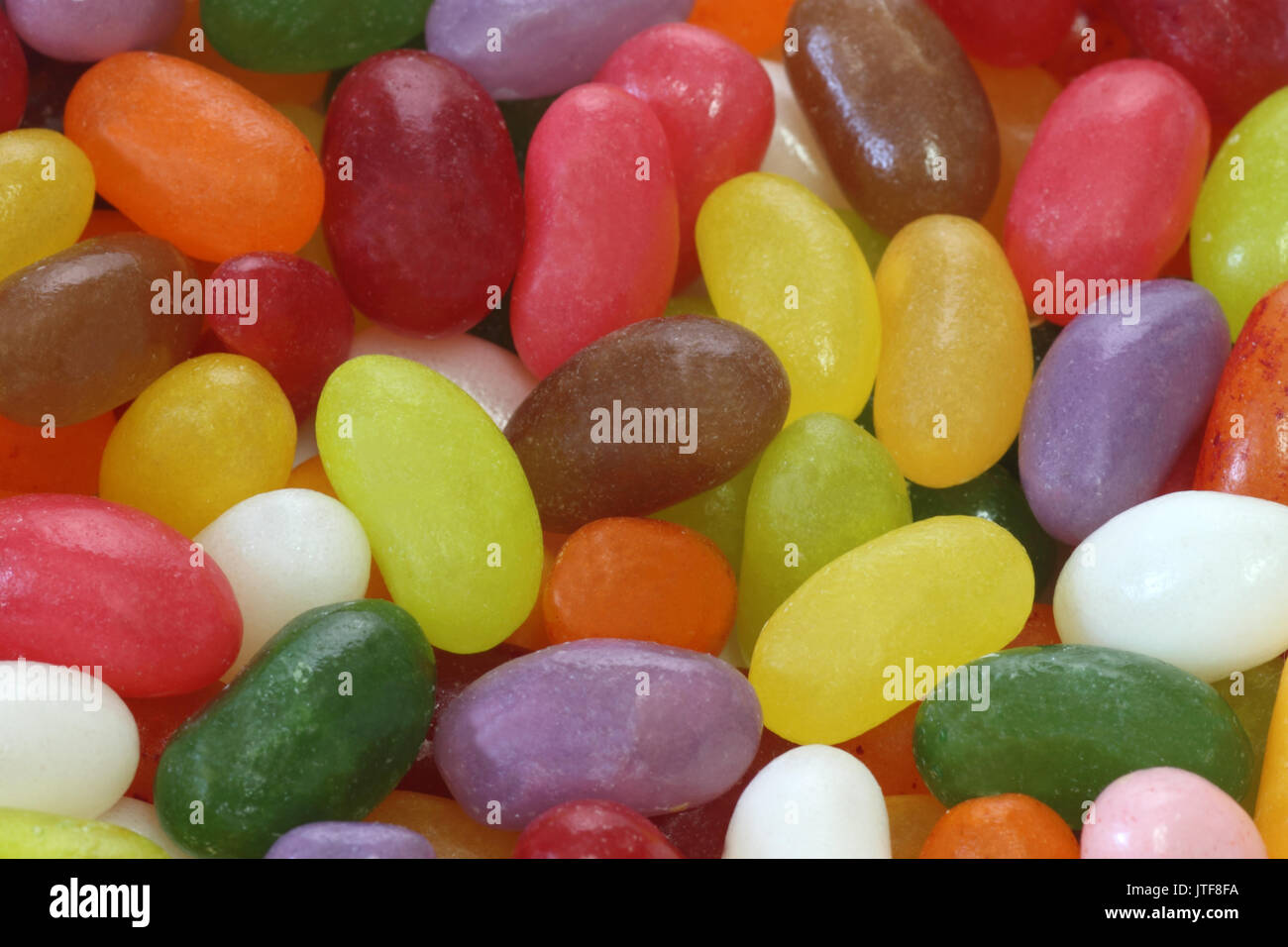 Lots of jelly beans in a colorful background of chewy goodness Stock ...