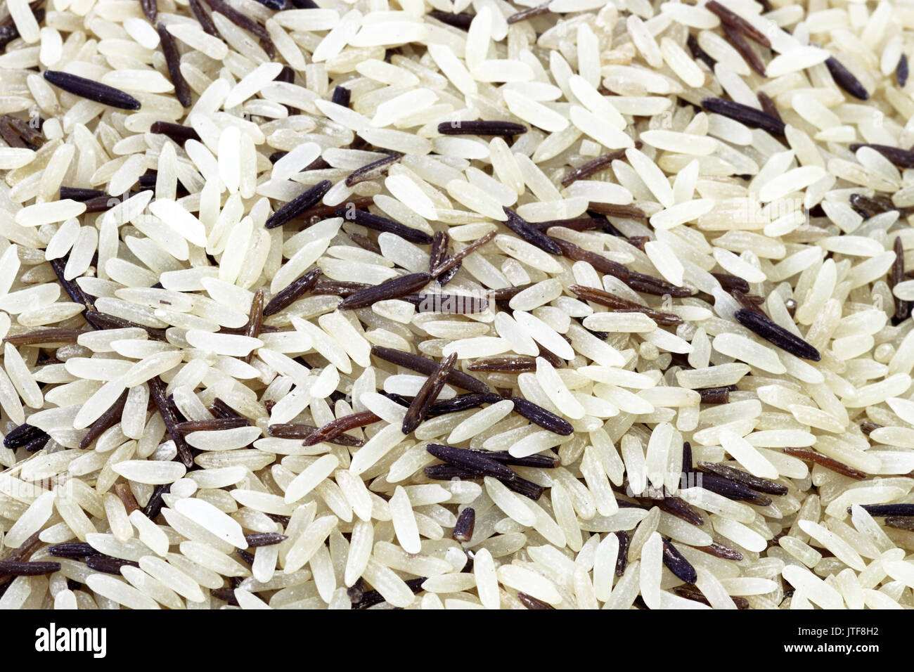 Long grain white and wild rice. Studio shot Stock Photo - Alamy