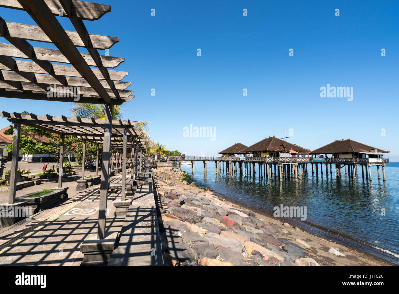 Traditional Balinese stilt houses in the sea at the old harbor ...