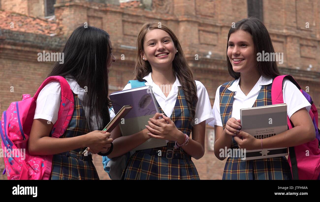 School Girls In Uniform Holding Books Stock Photo - Alamy