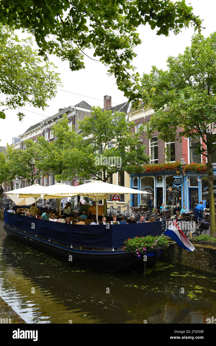 People eating on a Canal Barge Restaurant in Delft, South Holland, The ...