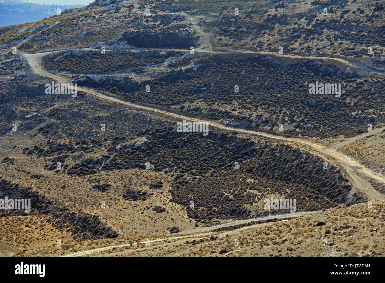 Rocky dirt road in the Judean desert wilderness as seen from Mt. Scopus ...