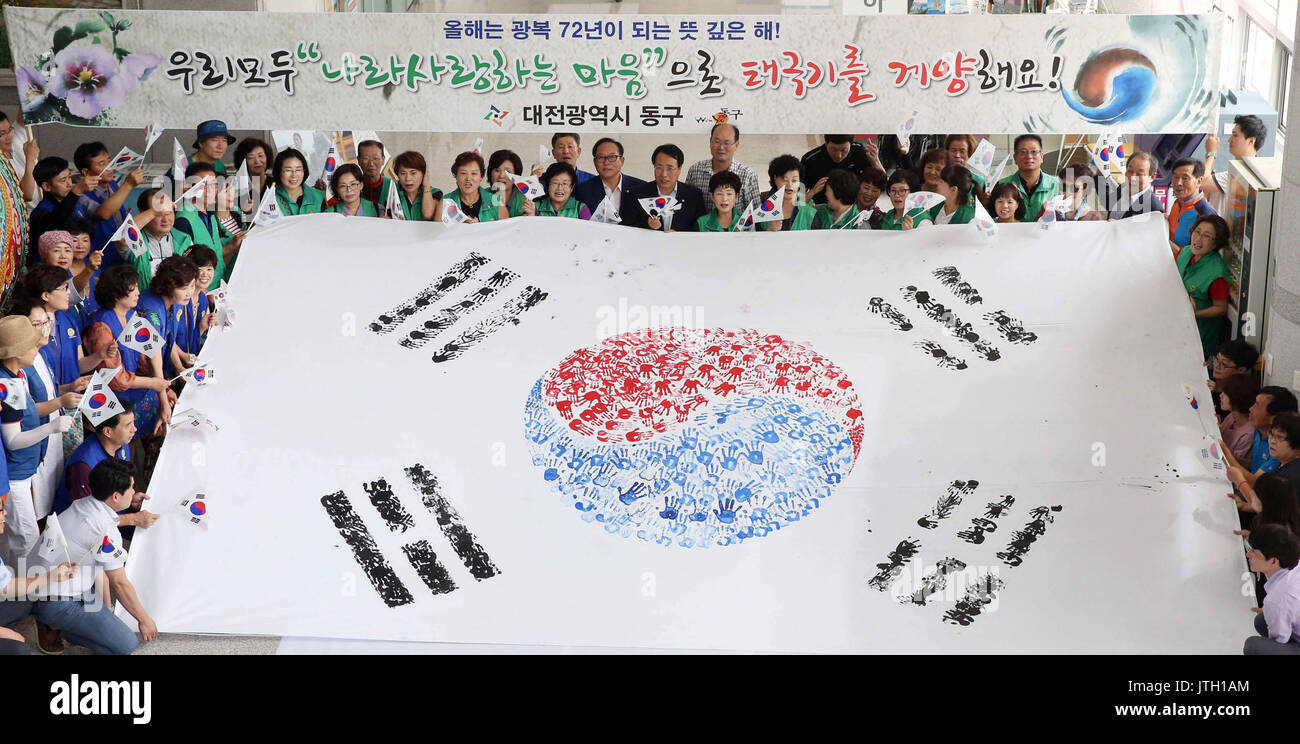 Taegeukgi with handprints People display the national flag Taegeukgi ...