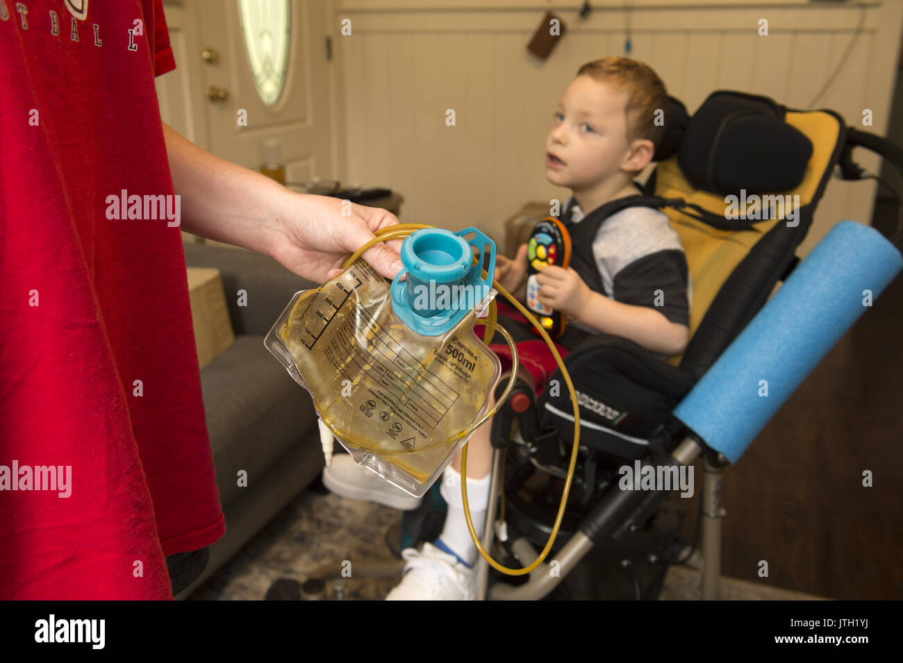 Severely disabled child at home hi-res stock photography and images - Alamy
