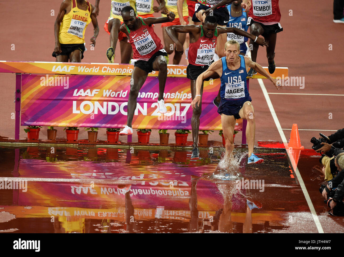 American athlete Evan Jager (R) leads the field in the men's 3000 metre ...