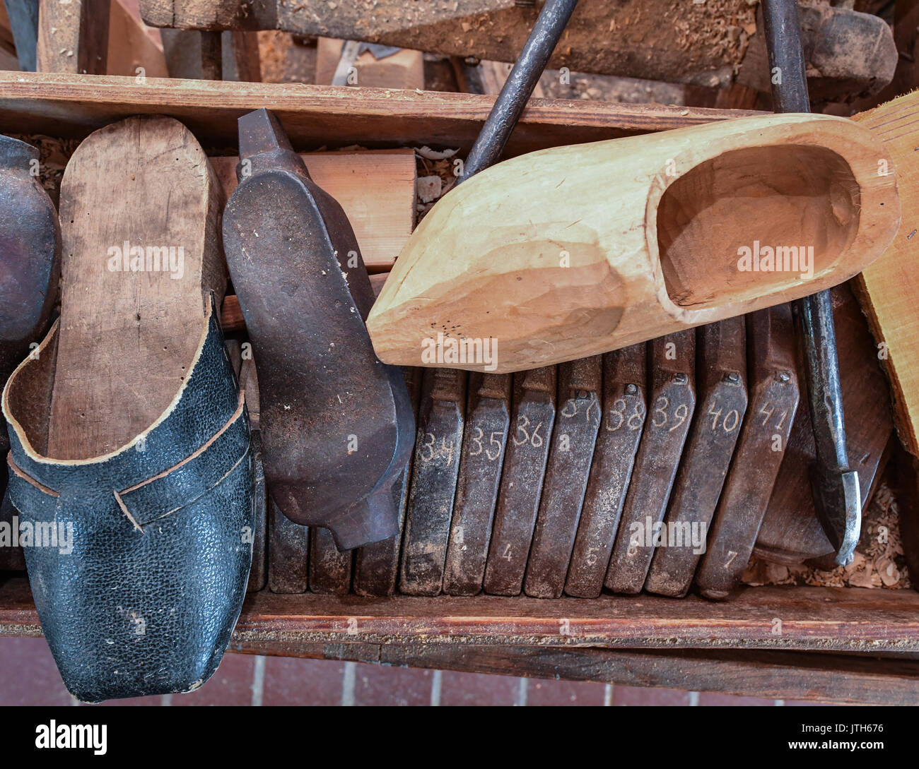 Clogs and tools in a workshop in the clog-making village of ...