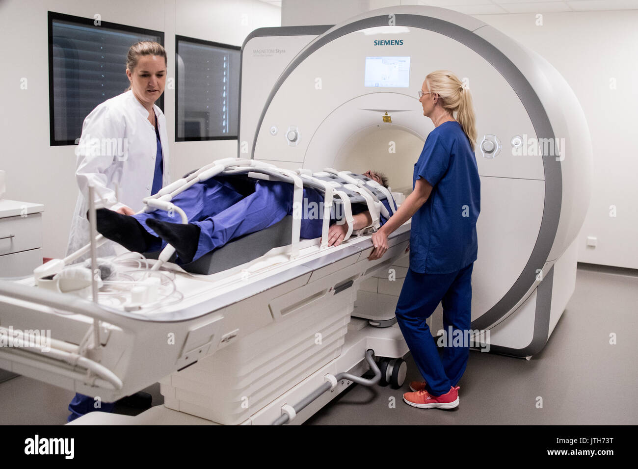 Simone Lohbeck (L), the director of the magnetic resonance imaging (MRI ...