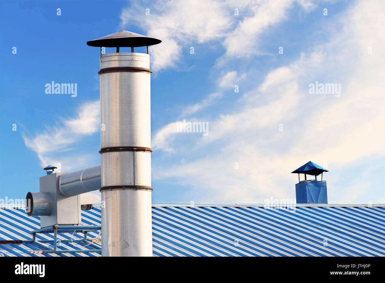 Kitchen chimney smoke and roof Stock Photo - Alamy