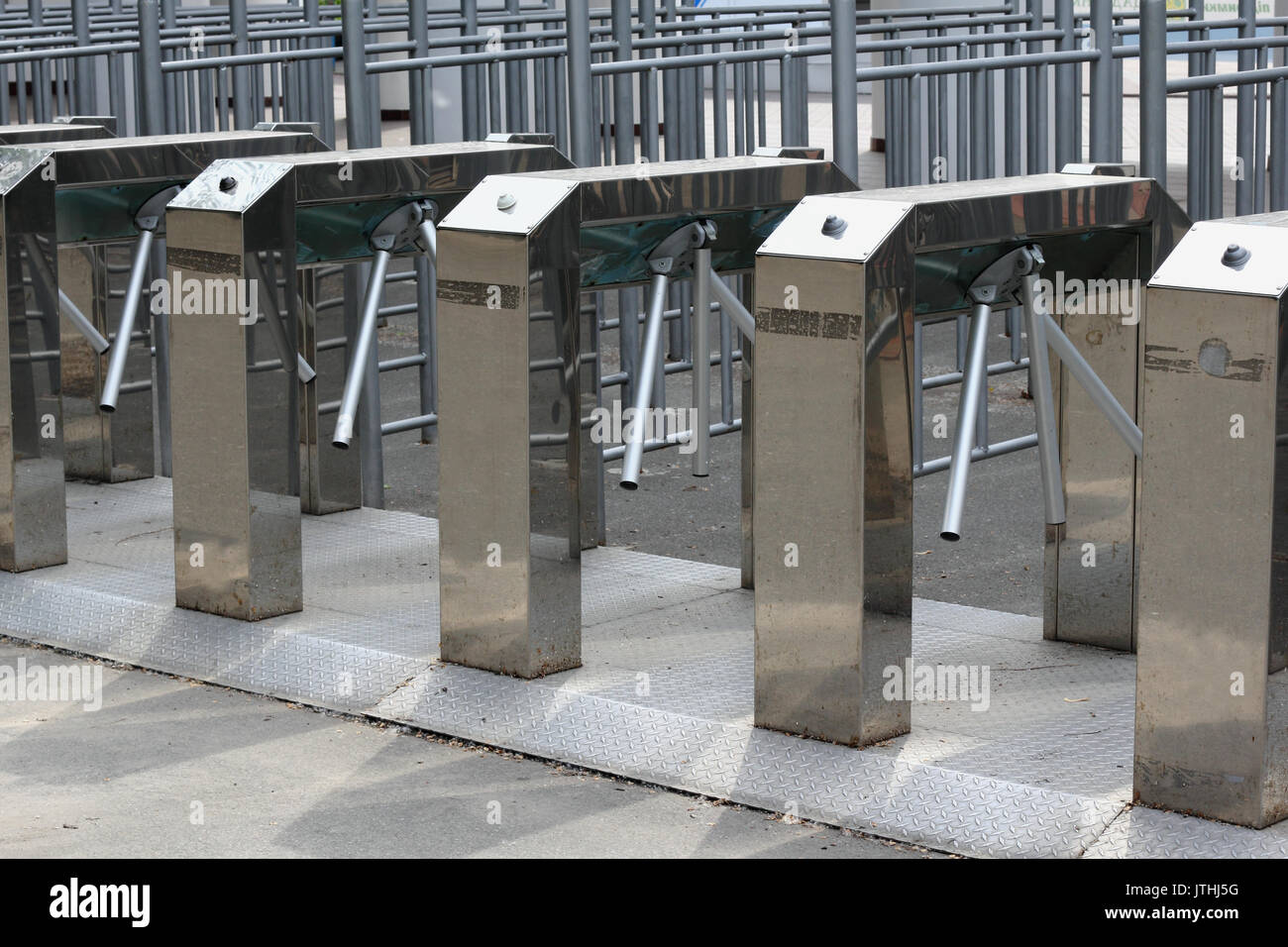 Modern nickel-plated turnstile rows Stock Photo - Alamy
