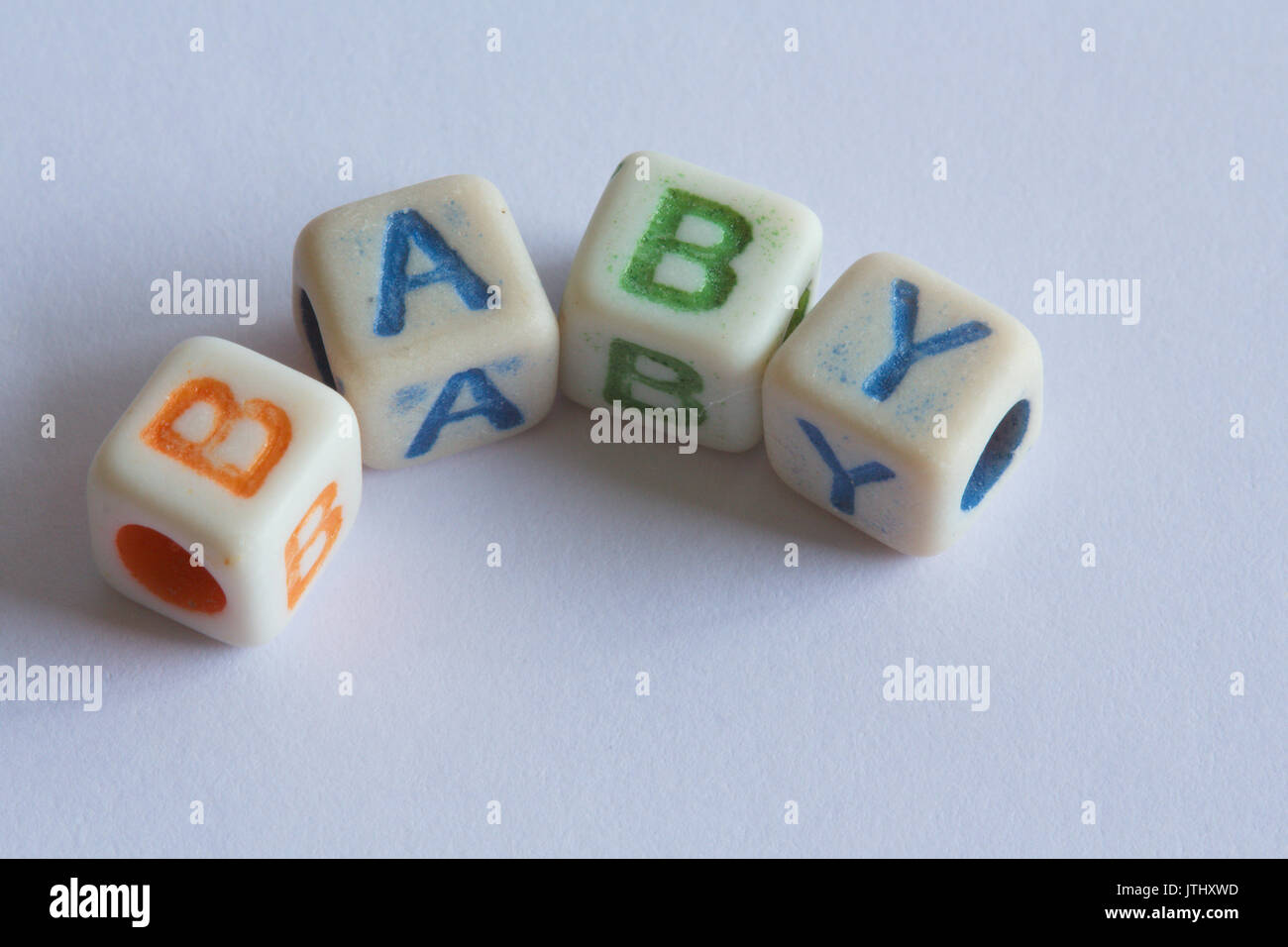 Miniature coloured craft blocks spelling "Baby Stock Photo - Alamy