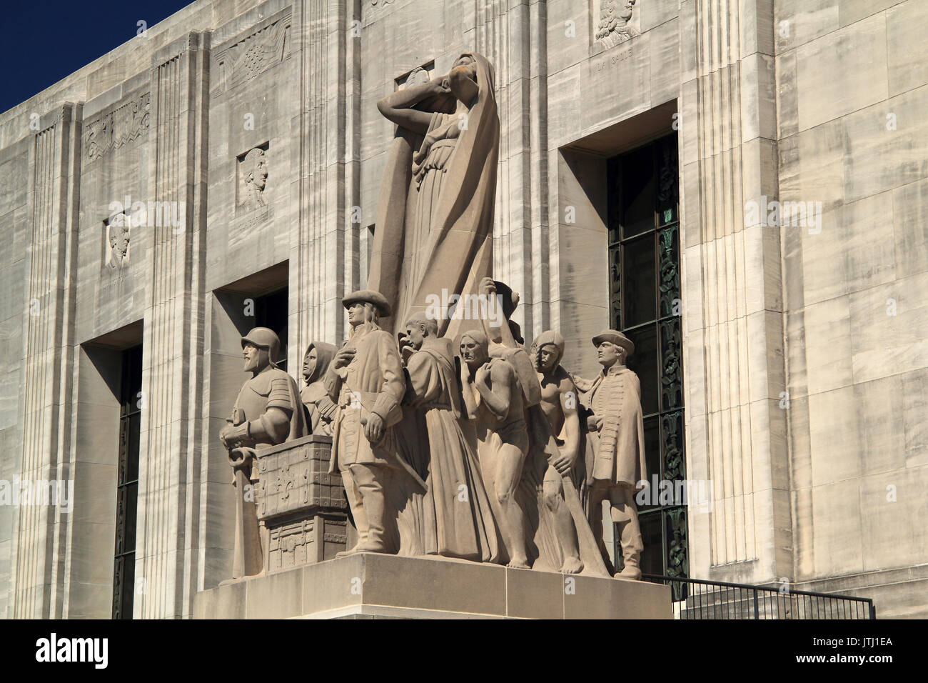 Elaborate sculptures at the base of the state capitol building ...