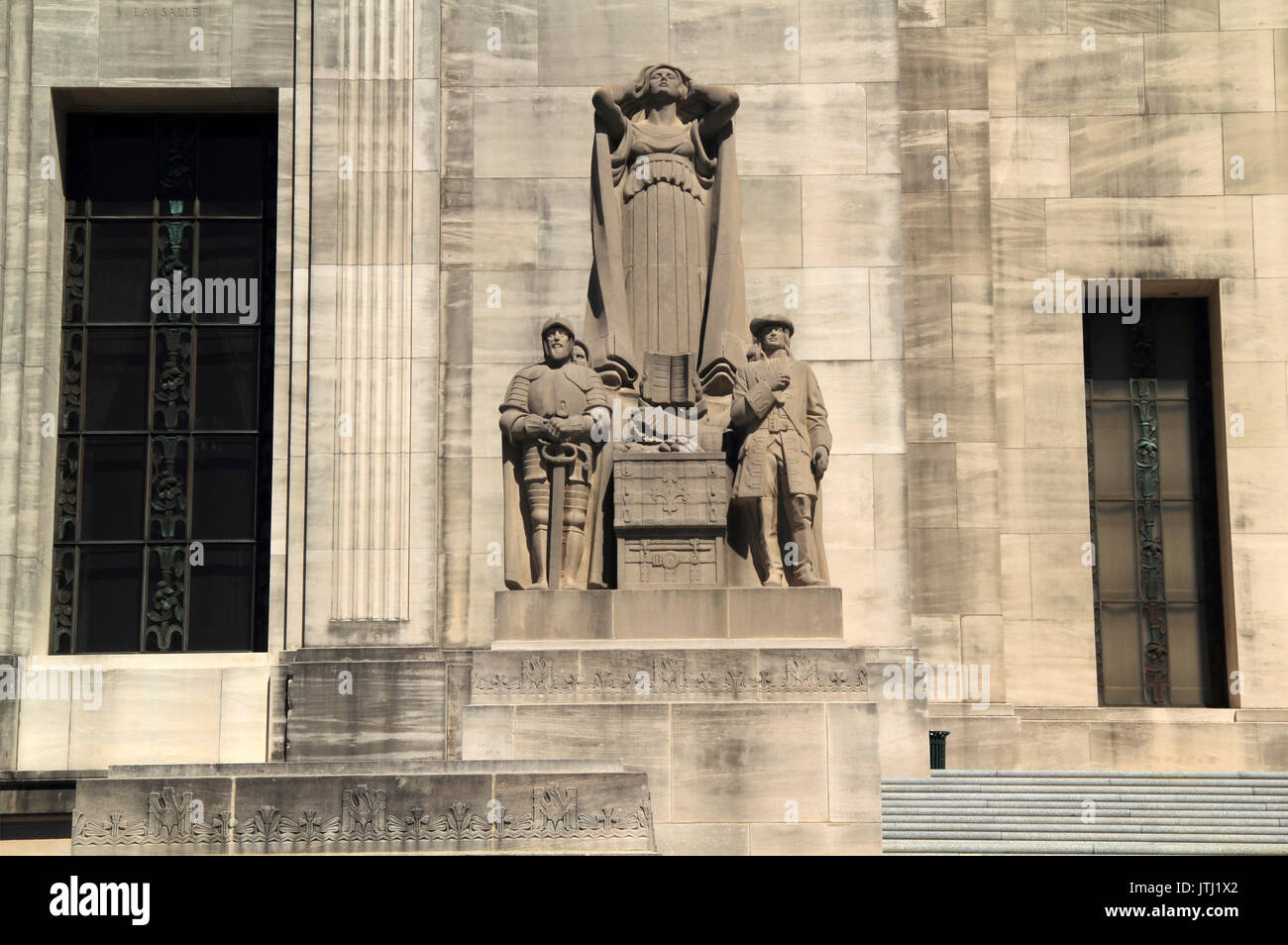 Elaborate sculptures at the base of the state capitol building ...