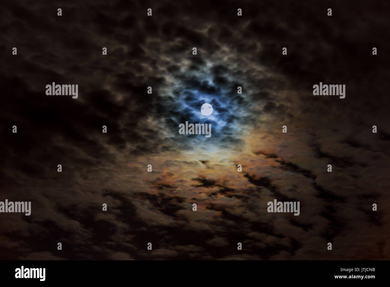 Night cloudy sky with full moon on a cloudy night Stock Photo - Alamy