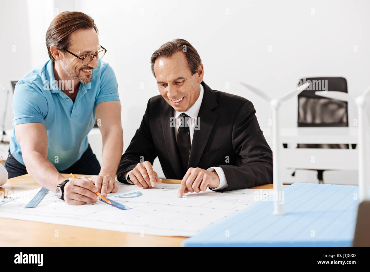 Young engineer following pieces of advice of boss Stock Photo - Alamy