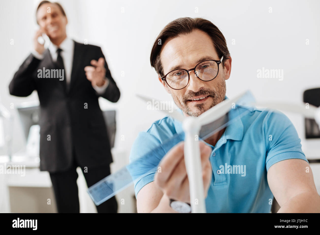 Engineer measuring wind turbine sail length with ruler Stock Photo - Alamy