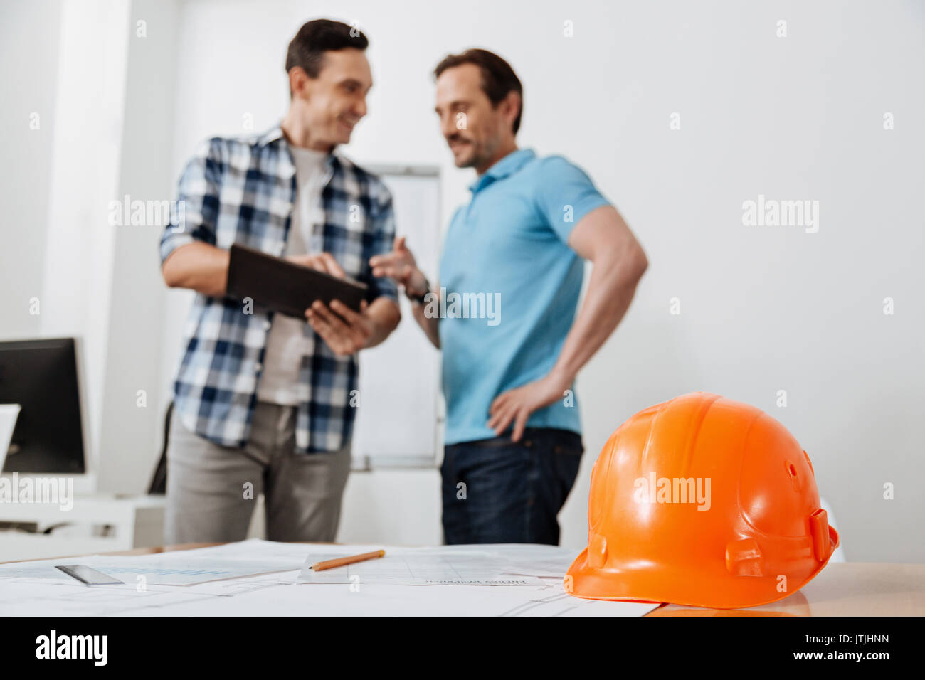 Two colleagues exchanging ideas about new project Stock Photo - Alamy