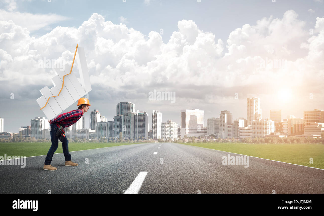 Engineer man carry progress graph Stock Photo - Alamy