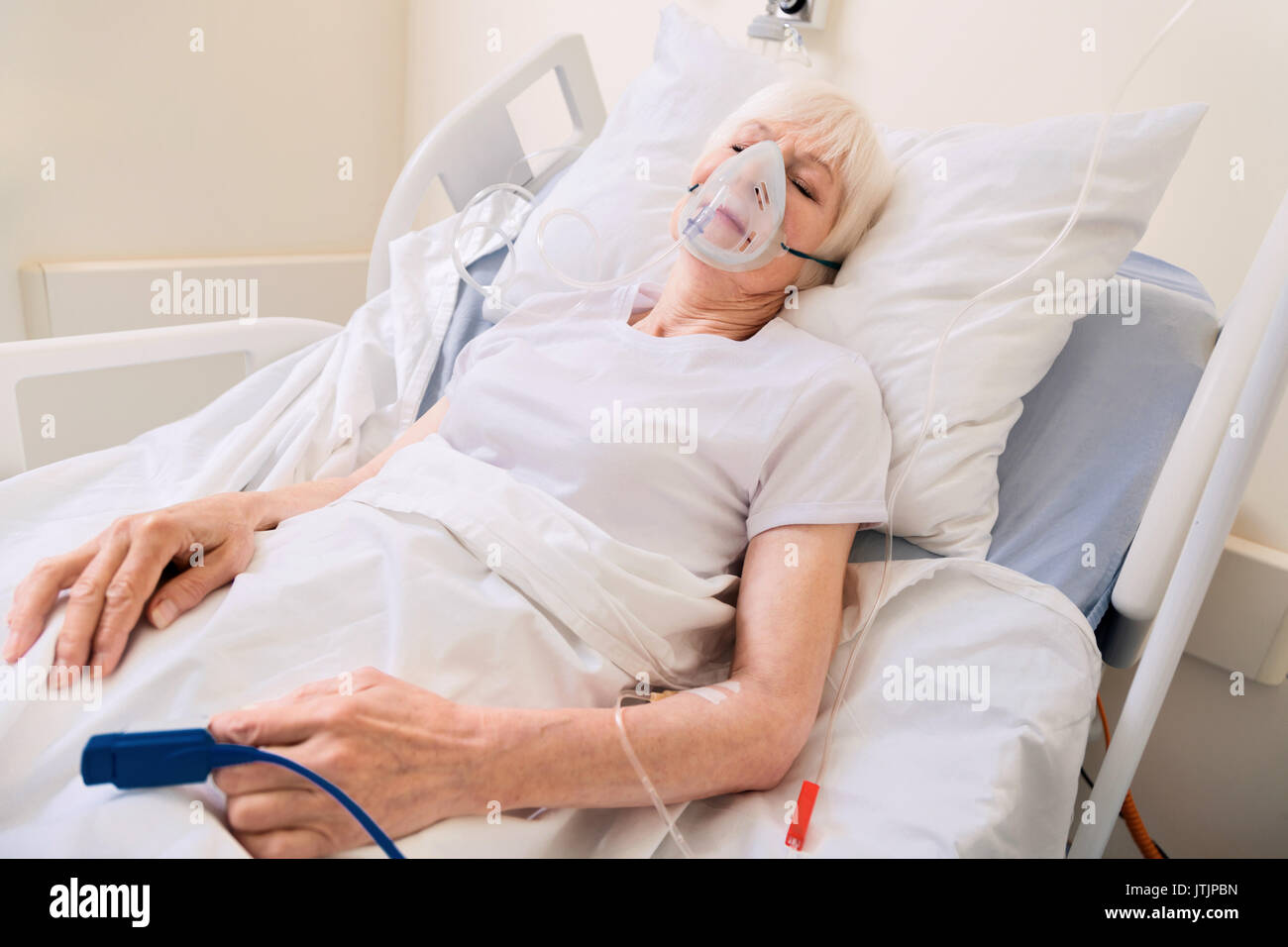 Aged vulnerable woman recovering from serious disease Stock Photo - Alamy
