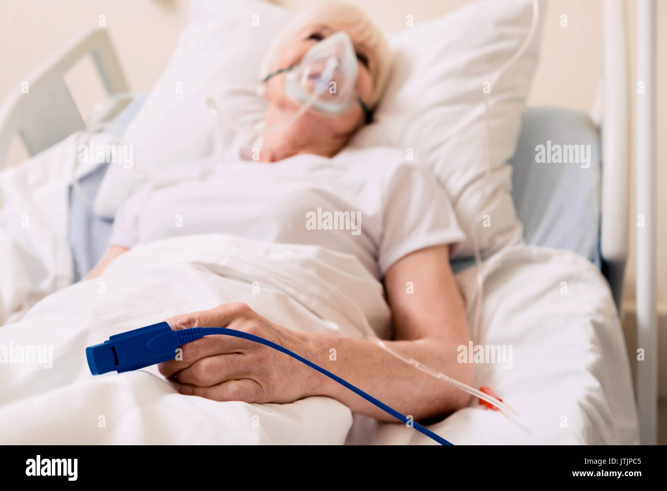 Delicate old woman getting high quality medical service Stock Photo - Alamy