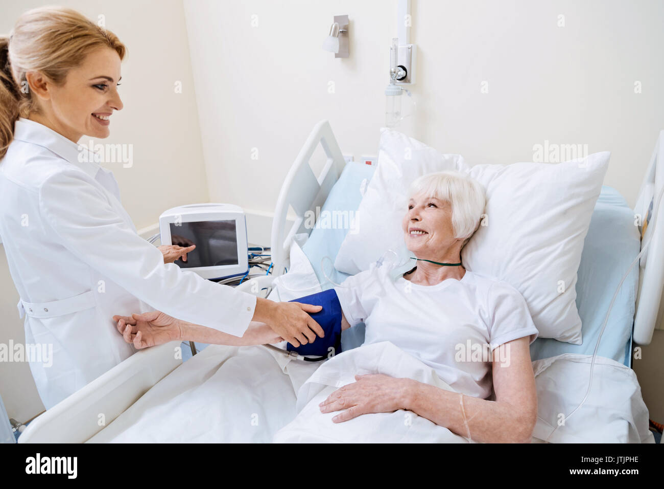 Lovely productive doctor running some tests Stock Photo - Alamy