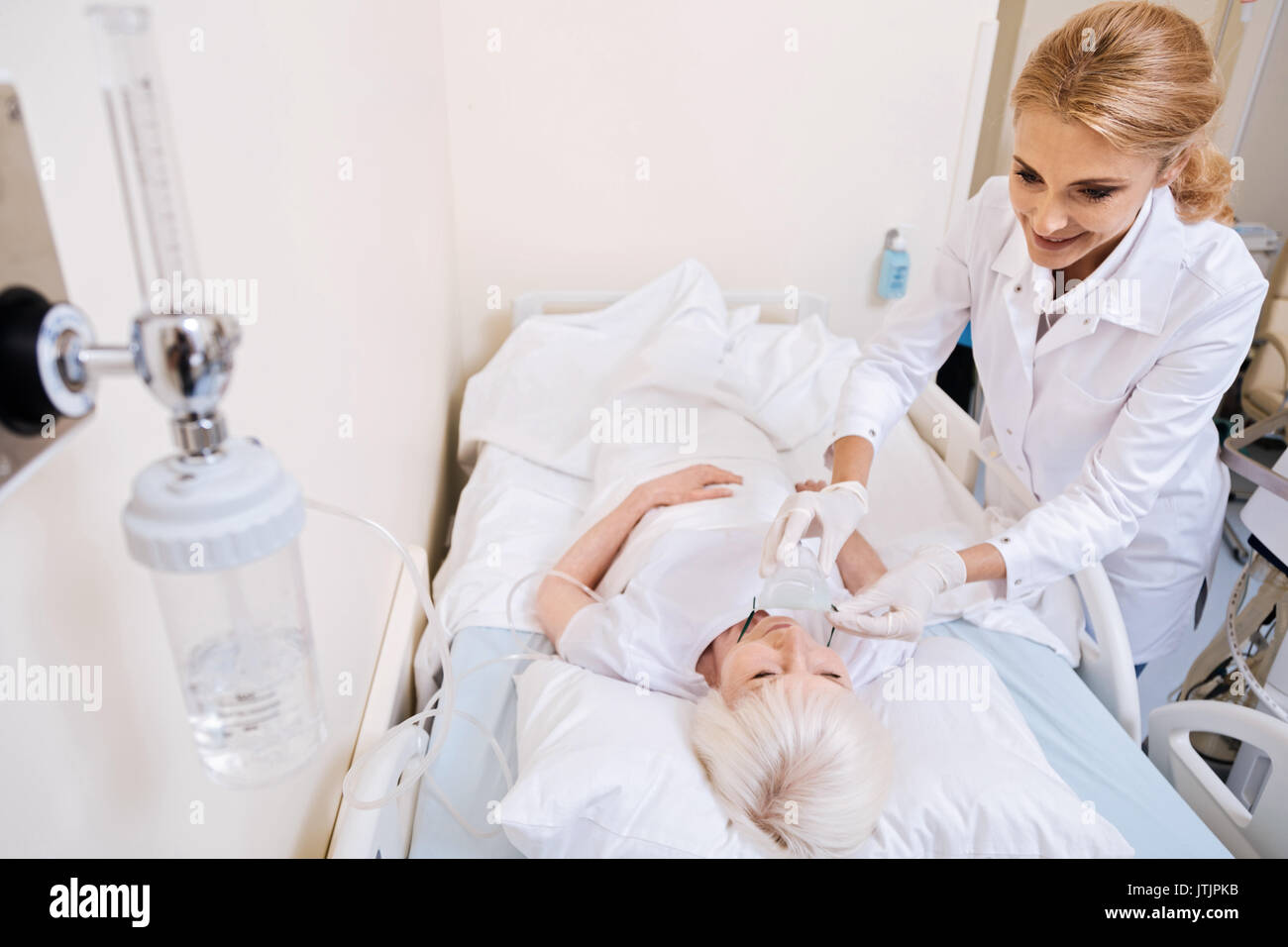 Mindful trained doctor conducting medical procedure Stock Photo - Alamy