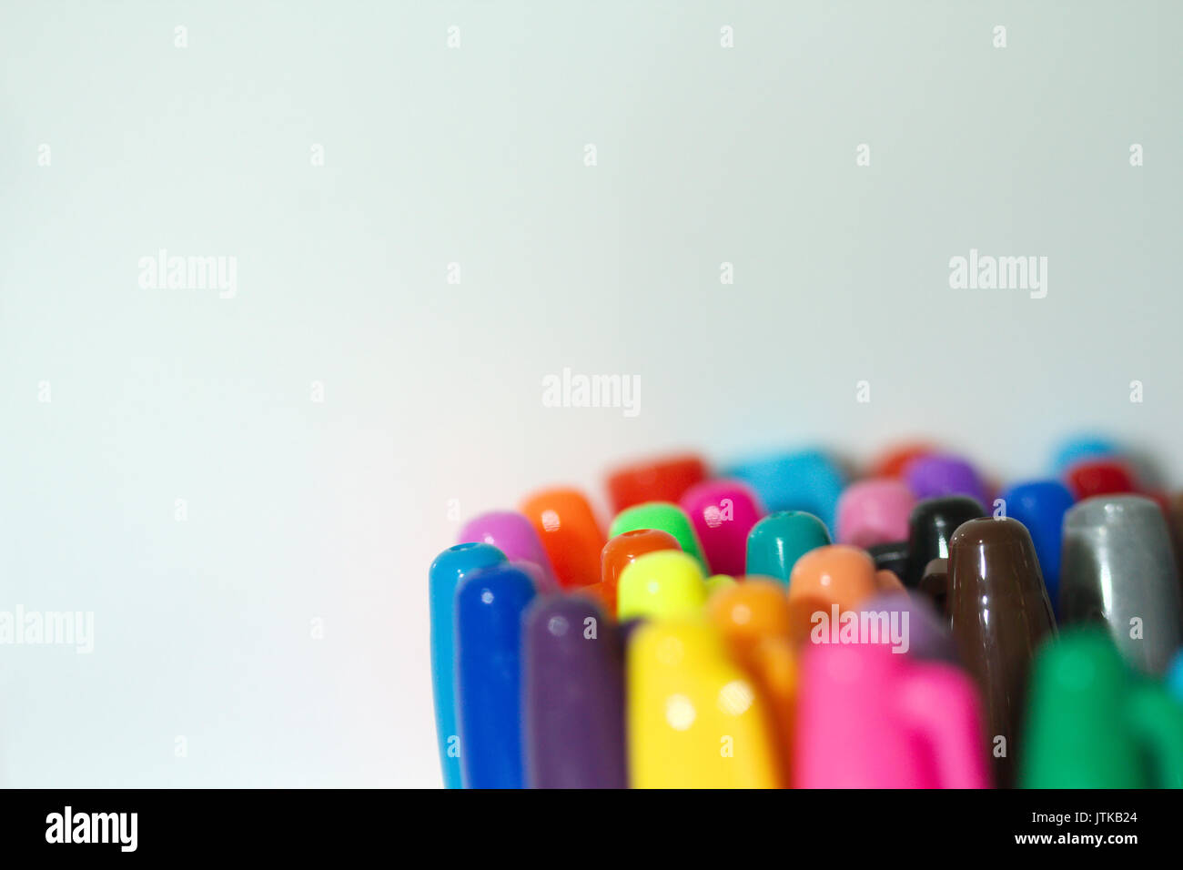 Coloured marker pens in a container with a white background Stock Photo ...