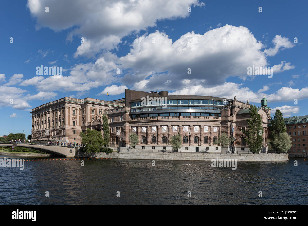 The Swedish parliament reflecting in the water on a bright summer’s day ...