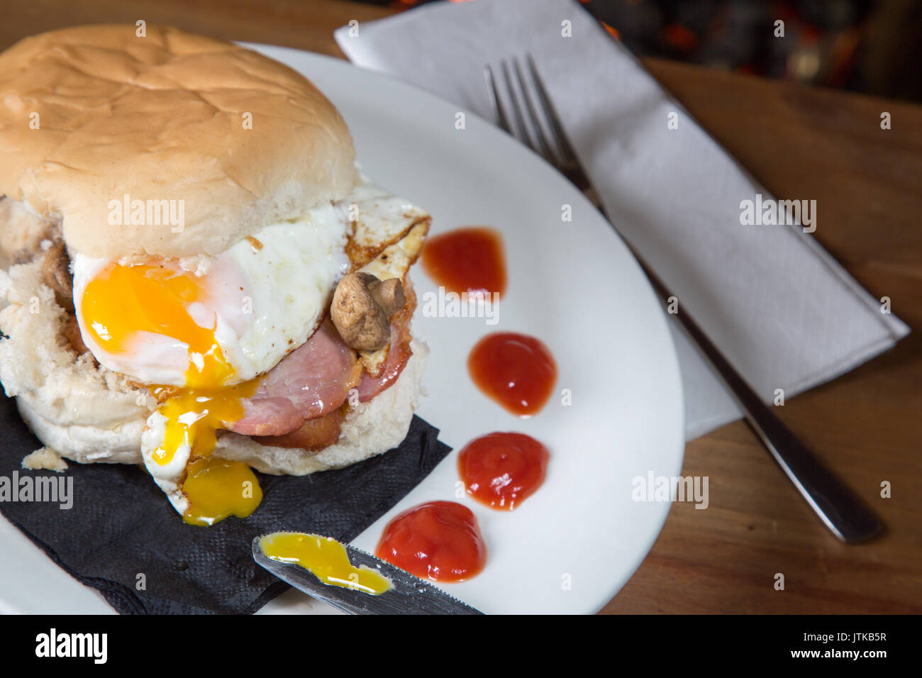 English breakfast in a bread roll Stock Photo - Alamy