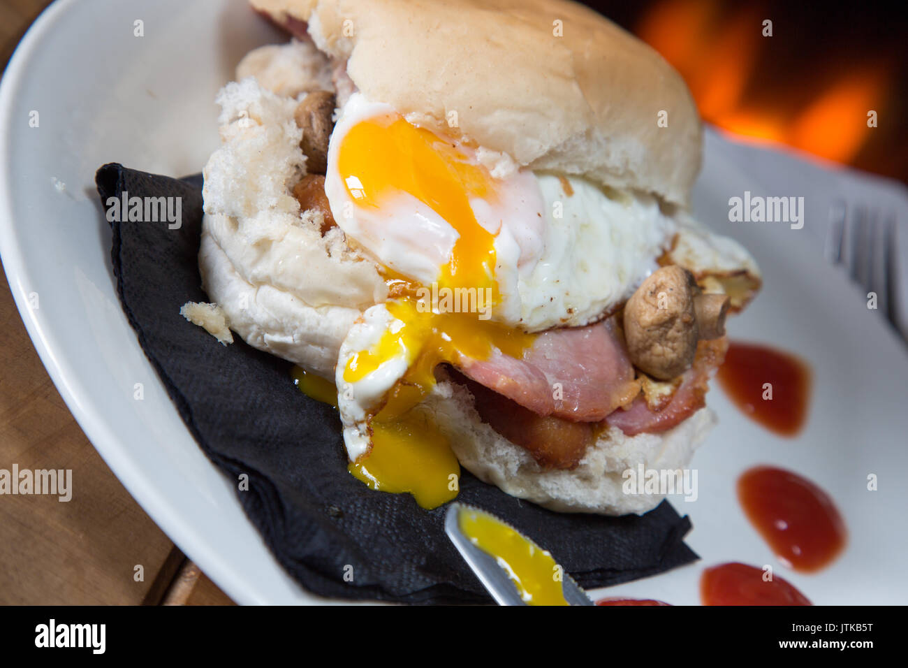 English breakfast in a bread roll Stock Photo - Alamy